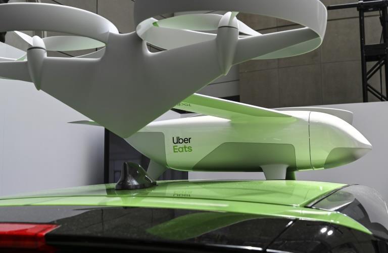 Uber eyes drones for food delivery, unveils new autonomous car